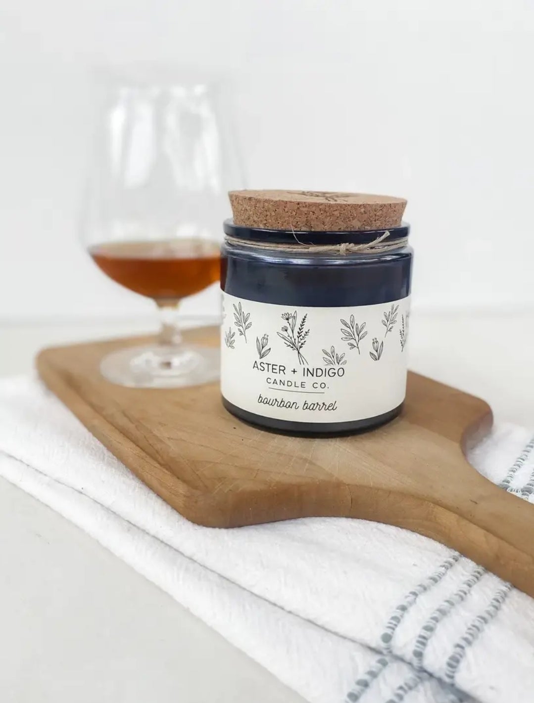 aster-indigo-bourbon-barrel-12-oz-candle-the-ivory-elephant-llc